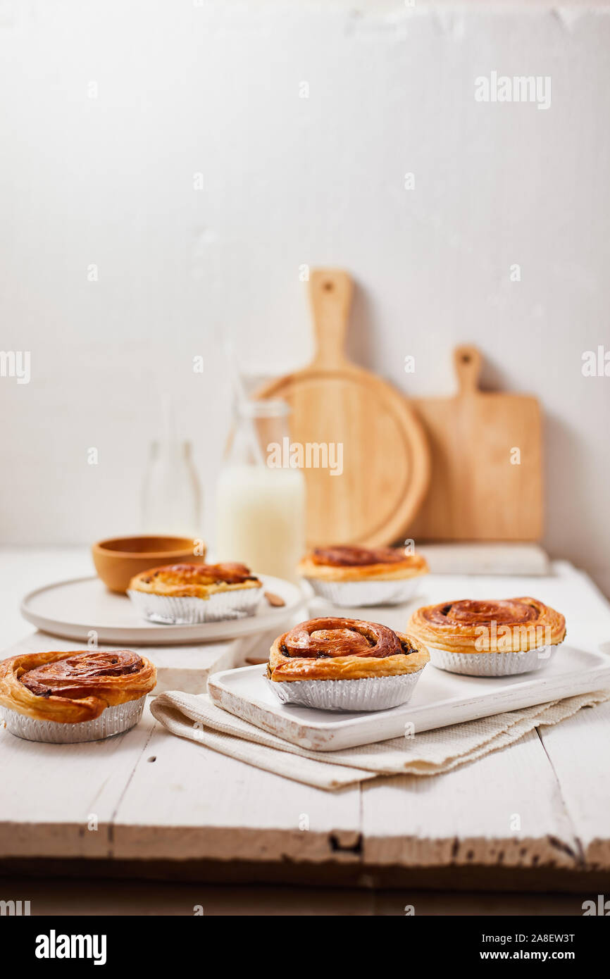 Fresh danish pastry with raisins on wood background.Tasty sweet bakery ...