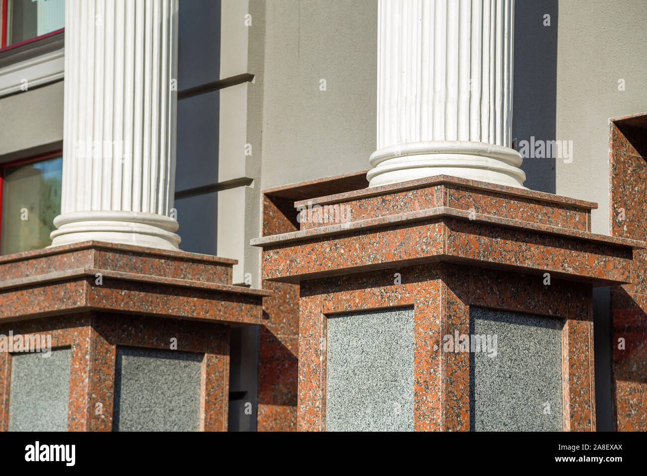 Detail of a house facade. Granite columns as decorative elements of the ...