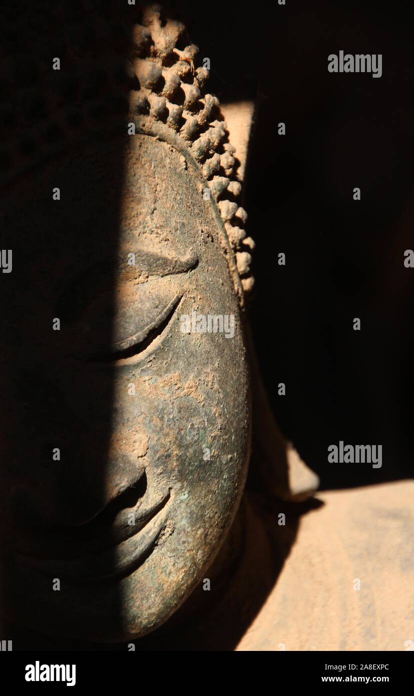 Half buddha face hi-res stock photography and images - Alamy