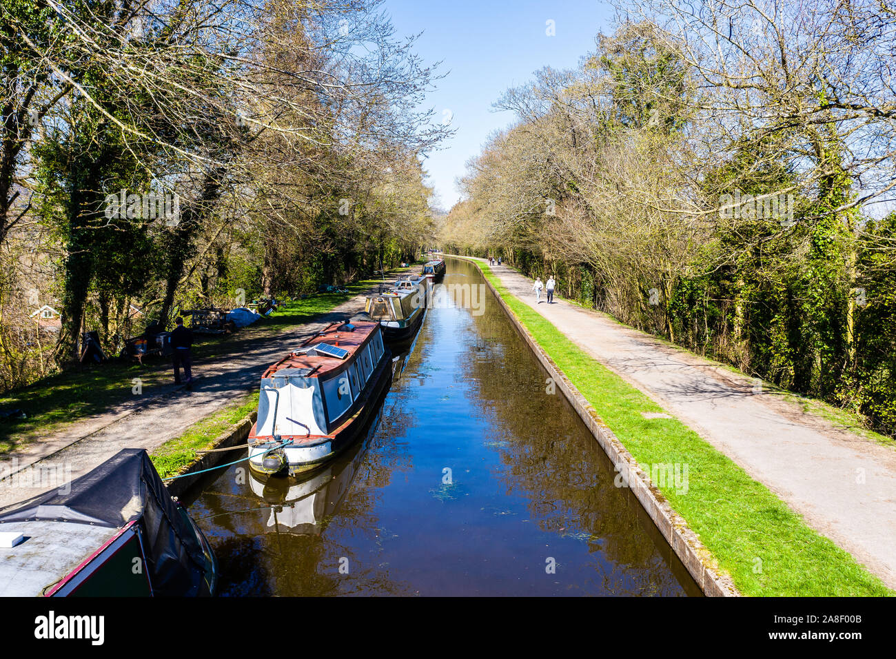 Aerial, overhead view of Narrow boats, canal boats heading down to the ...