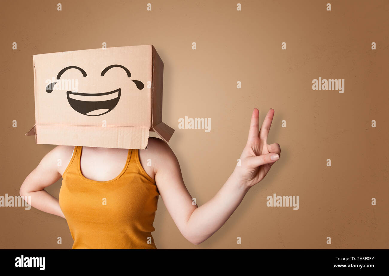 Funny woman wearing cardboard box on her head with smiley face Stock ...