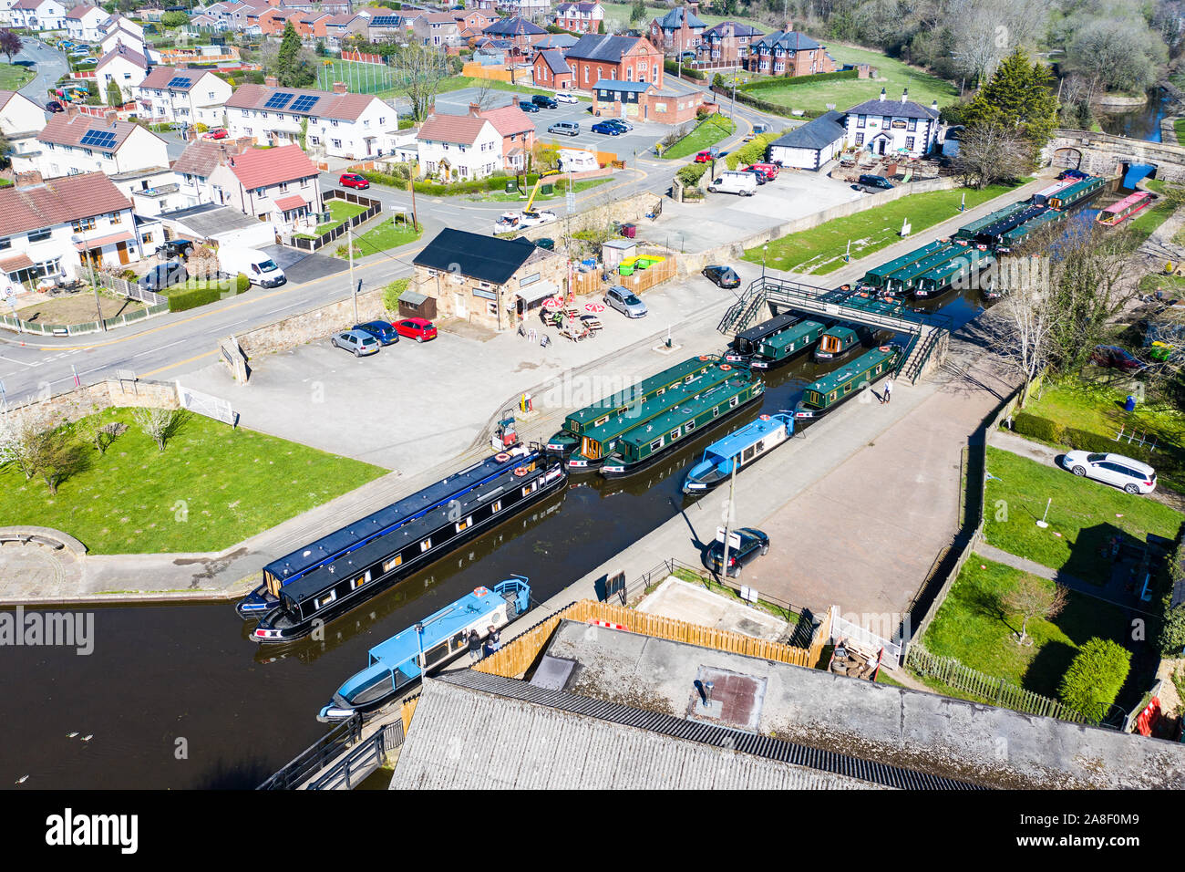 Aerial, overhead view of Narrow boats, canal boats heading down to the ...