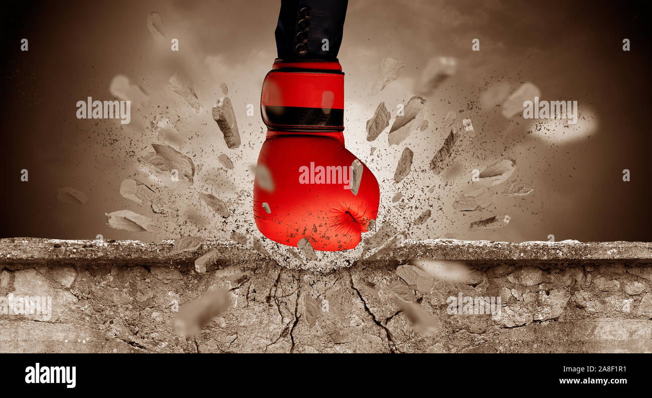 Big hand hits intense and breaks a crass stonewall Stock Photo - Alamy