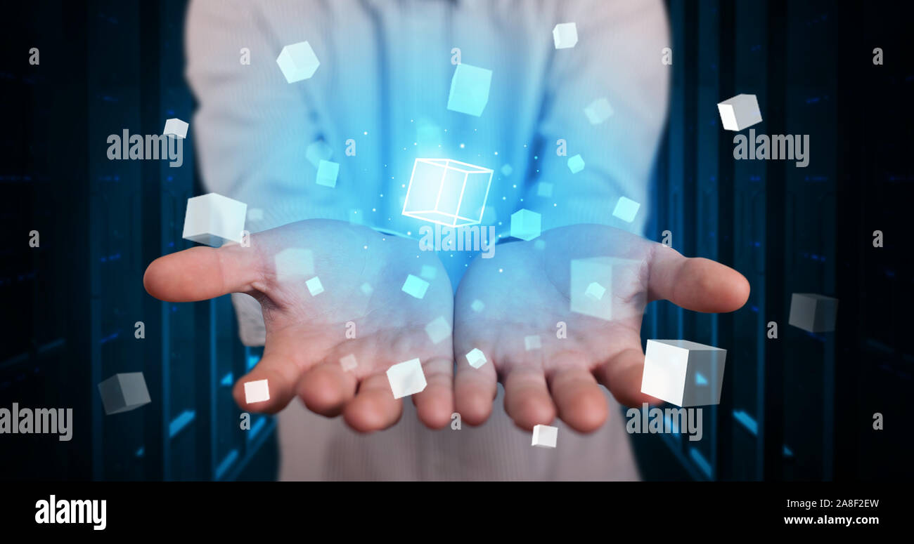 Person holding hologram projection displaying white cubes in server ...