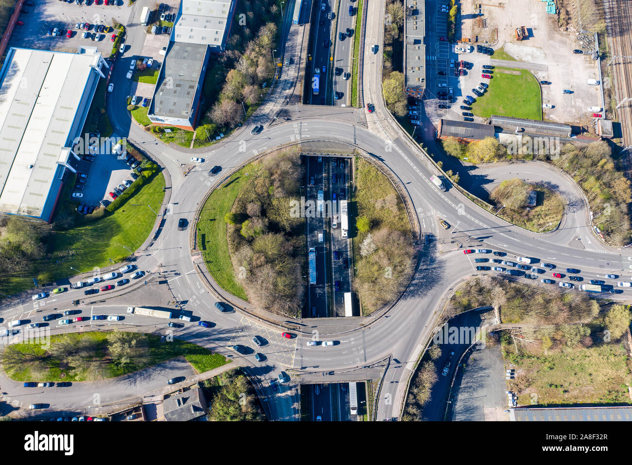 Aerial overhead view of a roundabout, highway during busy congestion ...