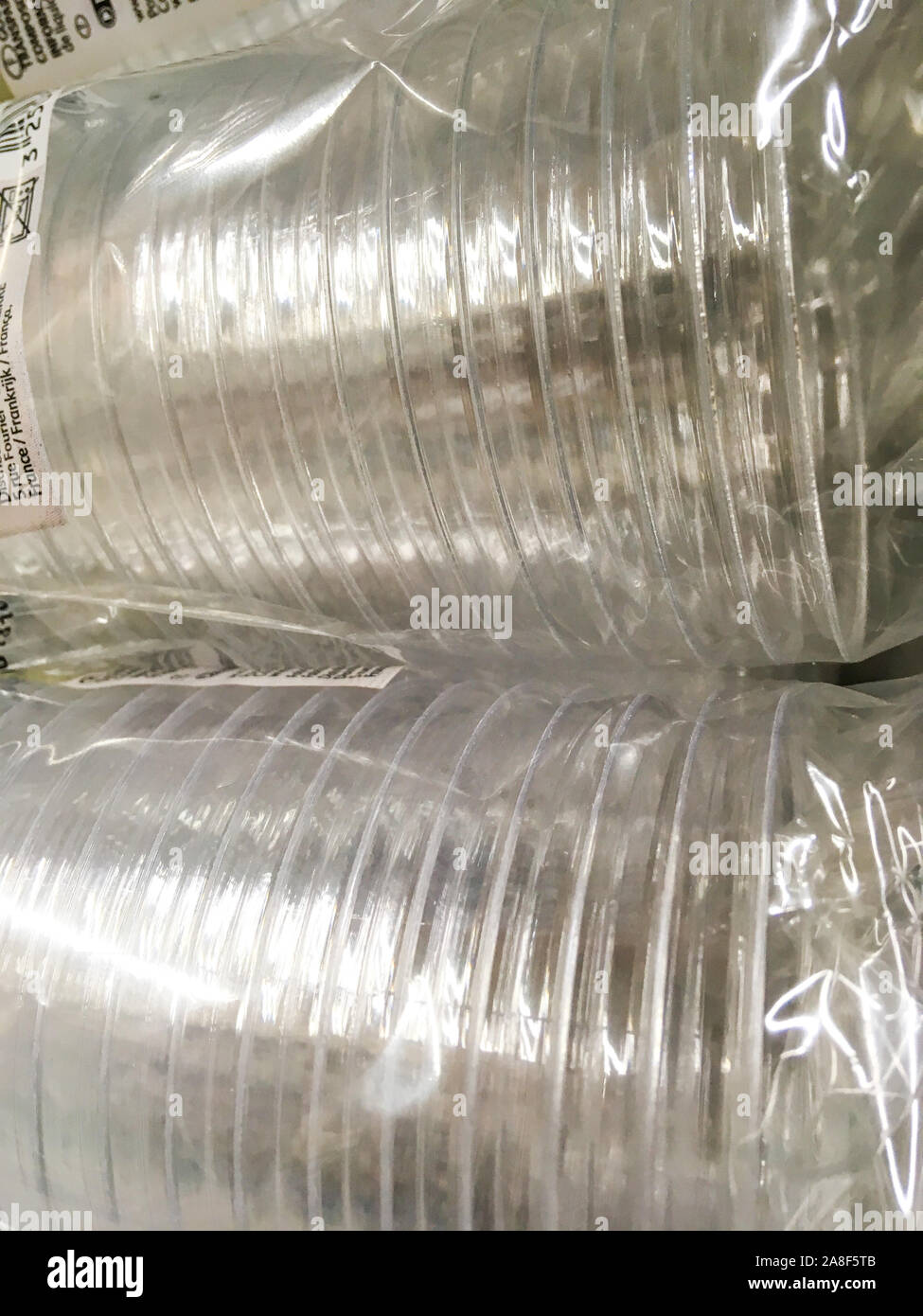 Single use plastic glasses packed under plastic package, Lyon, France ...