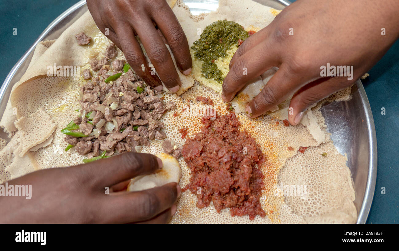 Ethiopian food and eating with hands hi-res stock photography and ...