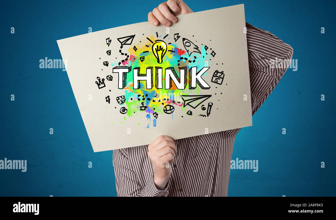 Young person holding paper with design thinking concept Stock Photo - Alamy