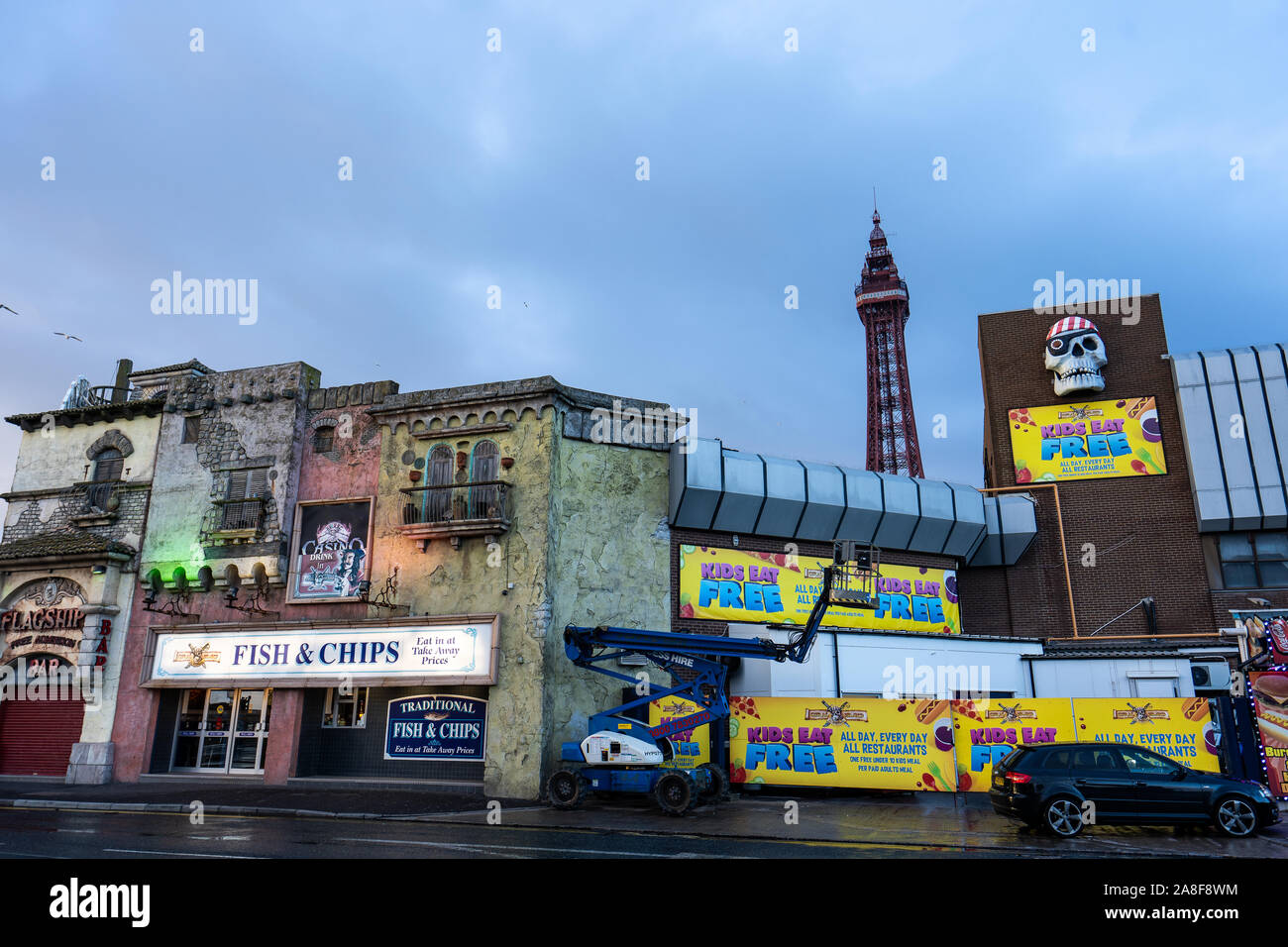 The world famous Blackpool Tower and beach surrounded by hotels, pubs ...