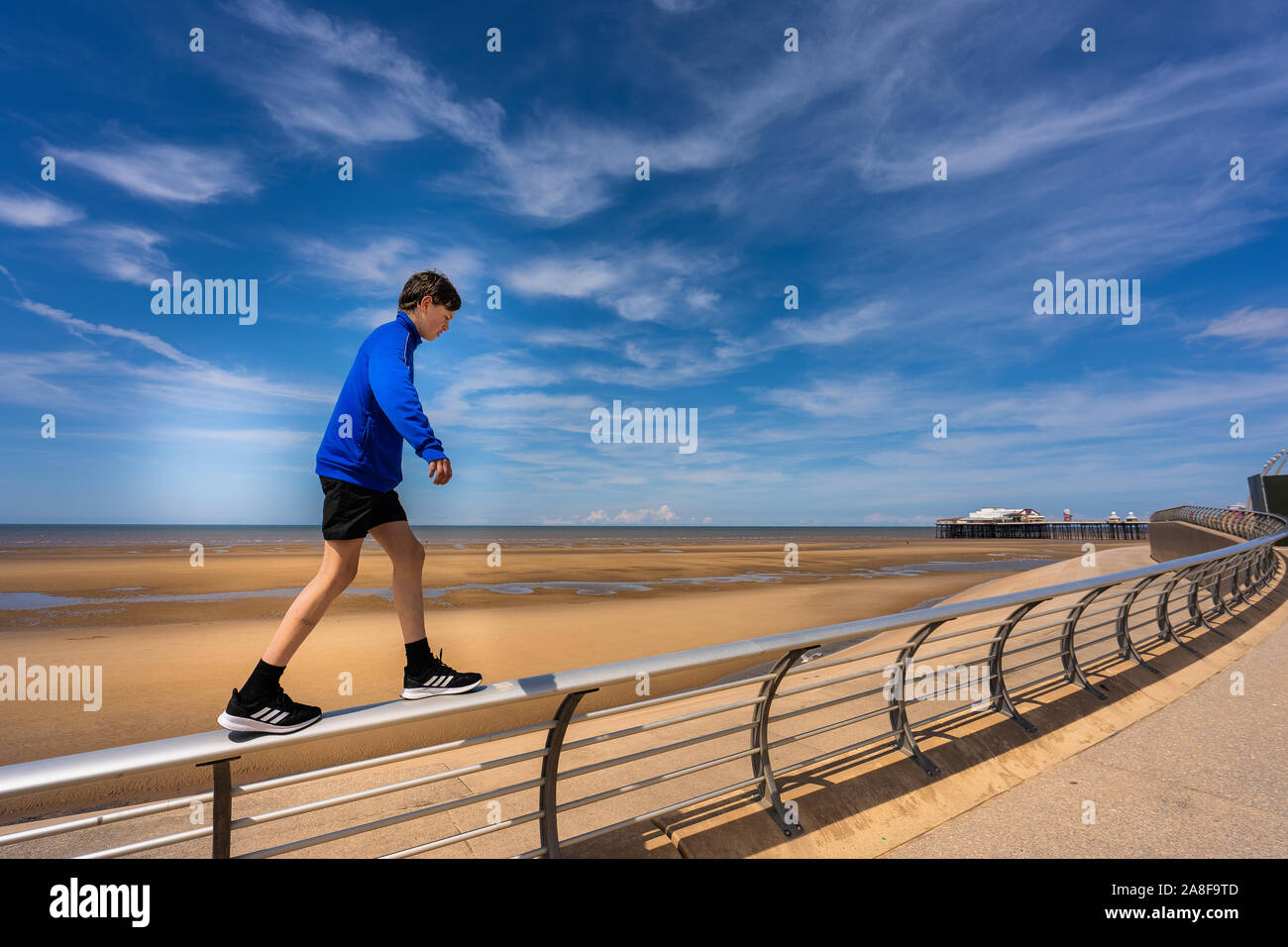 A handsome little boy with ADHD, Autism, Asperger syndrome walking ...