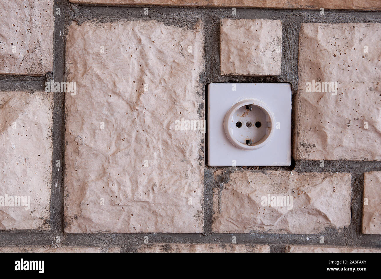 real pure stone texture of wall with socket Stock Photo - Alamy