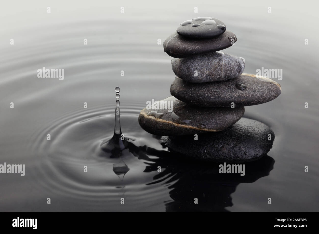 A zen balance stones in a water with water drop Stock Photo - Alamy