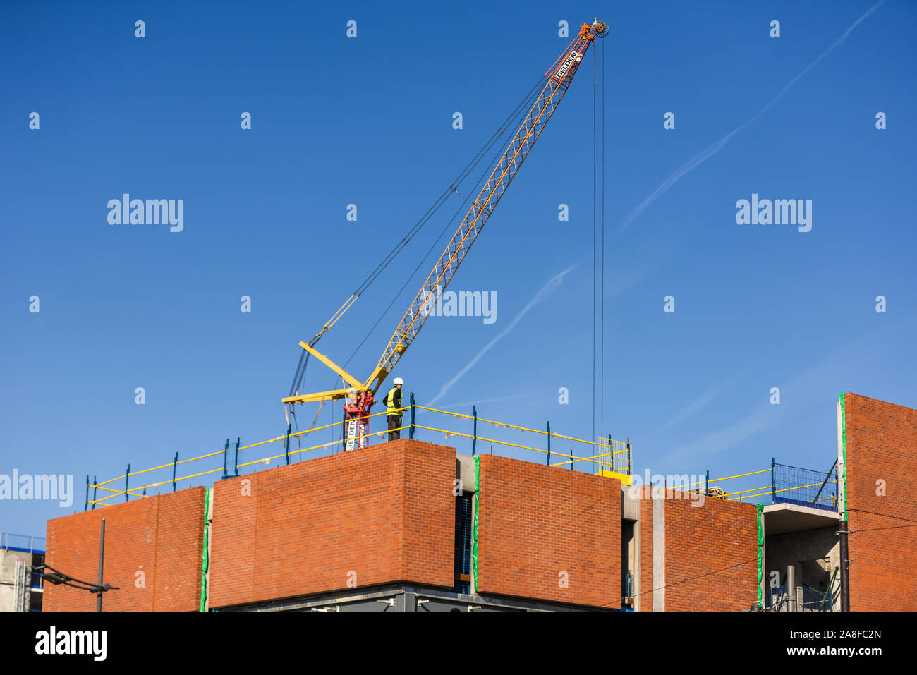 Hilton building cranes structure hi-res stock photography and images ...