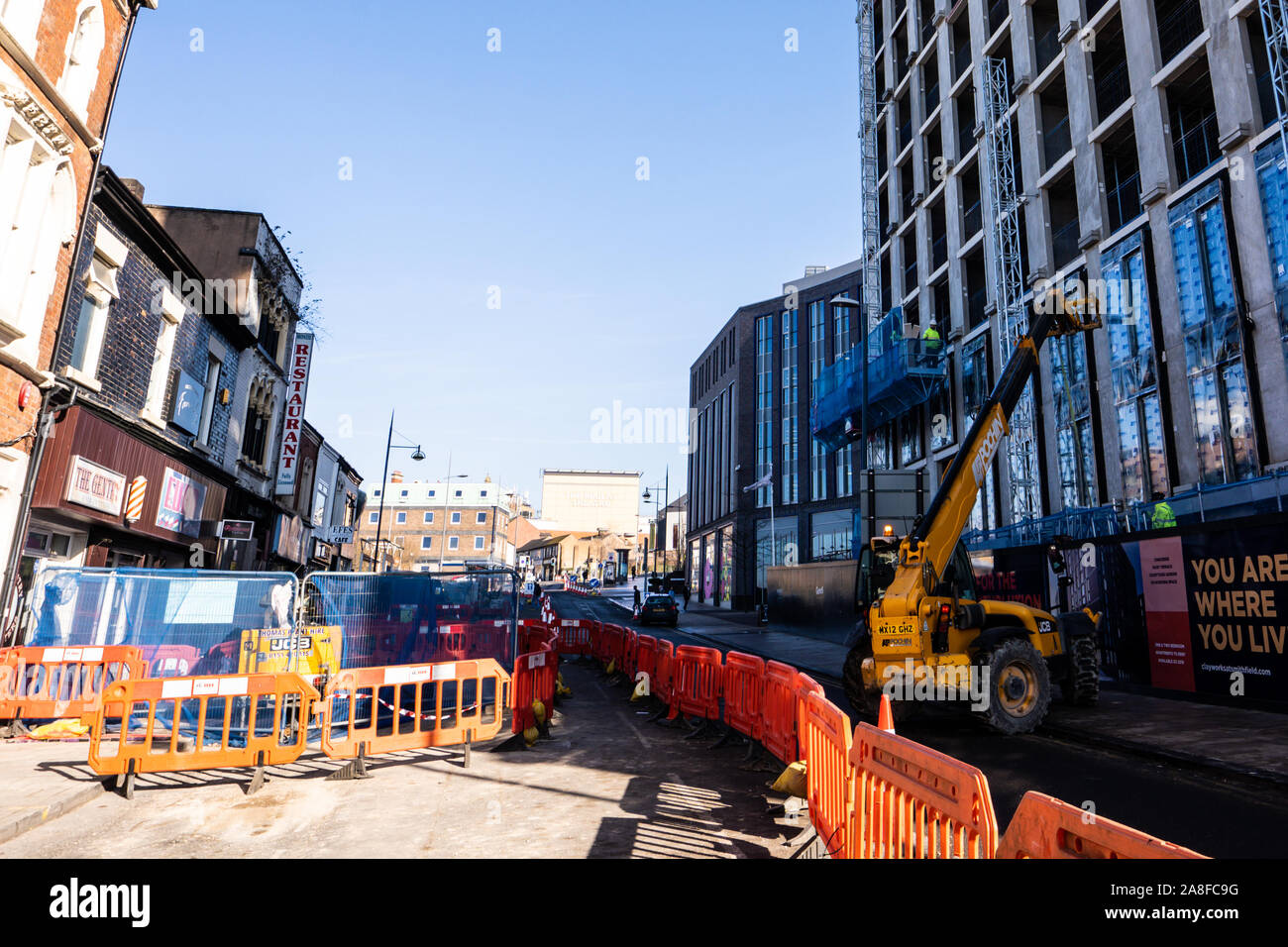 A JCB driver works on the new Hilton Hotel building, structure in Stoke ...