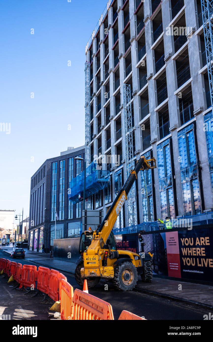 A JCB driver works on the new Hilton Hotel building, structure in Stoke ...