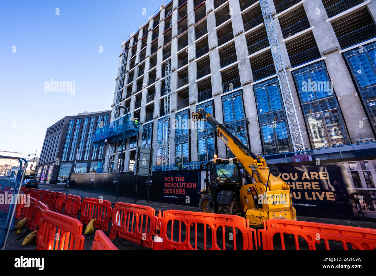 A JCB driver works on the new Hilton Hotel building, structure in Stoke ...