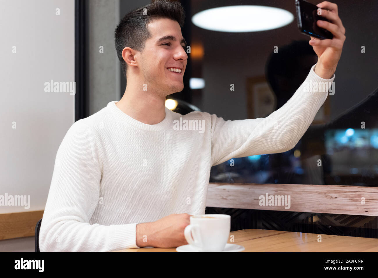 Young man self portrait shop hi-res stock photography and images - Alamy