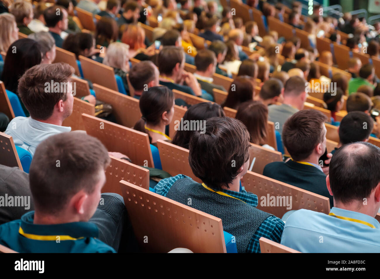 Attendees sit hi-res stock photography and images - Alamy