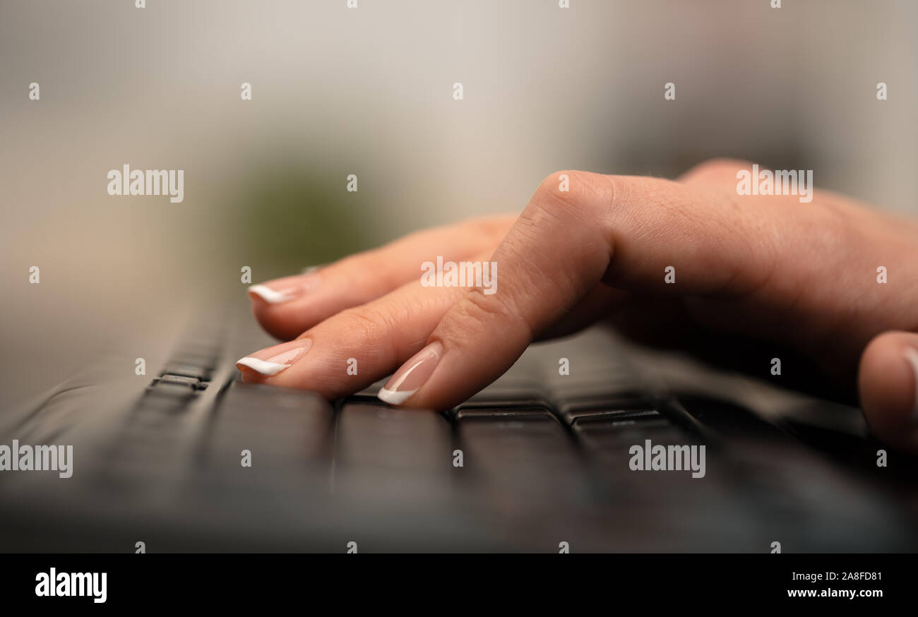 Hand typing on keyboard with office concept Stock Photo - Alamy