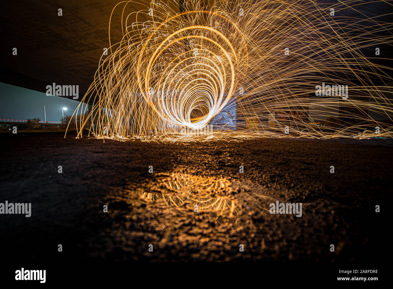 Burning Steel Wool spinning. Showers of glowing sparks from spinning ...