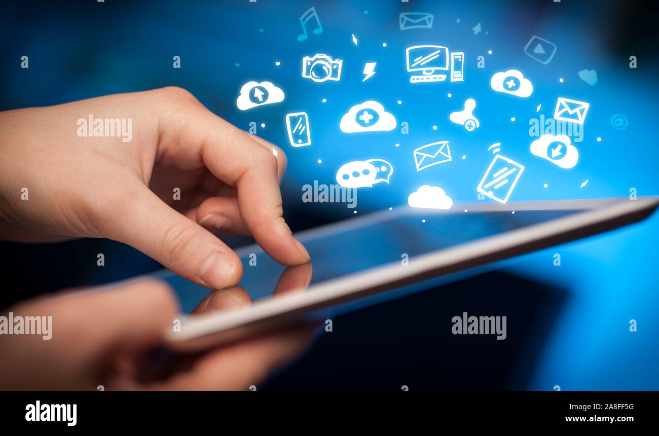 Hand holding tablet with social media concept Stock Photo - Alamy