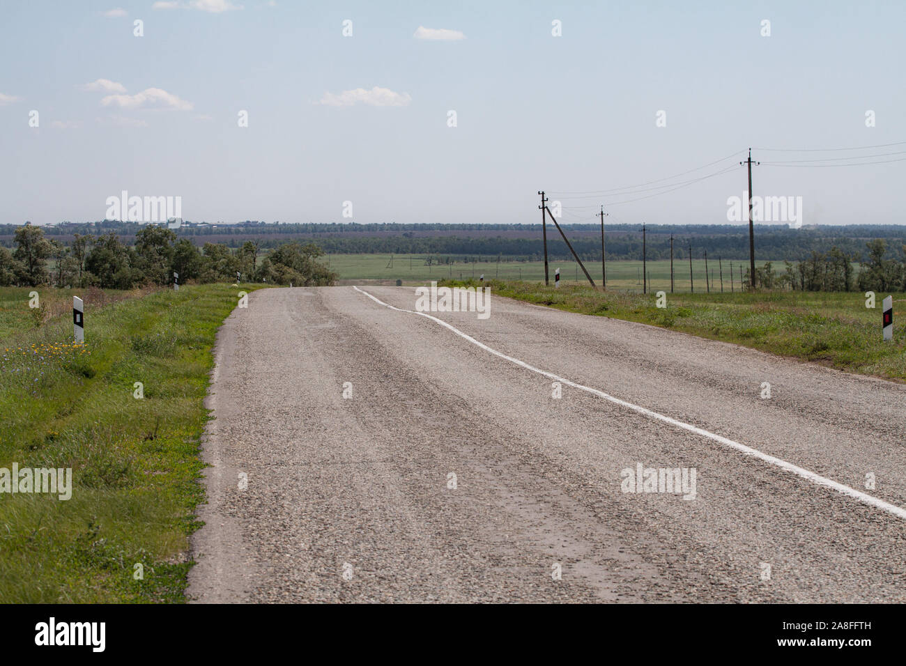 Smooth asphalt road to the mountains road to the distance beyond the ...