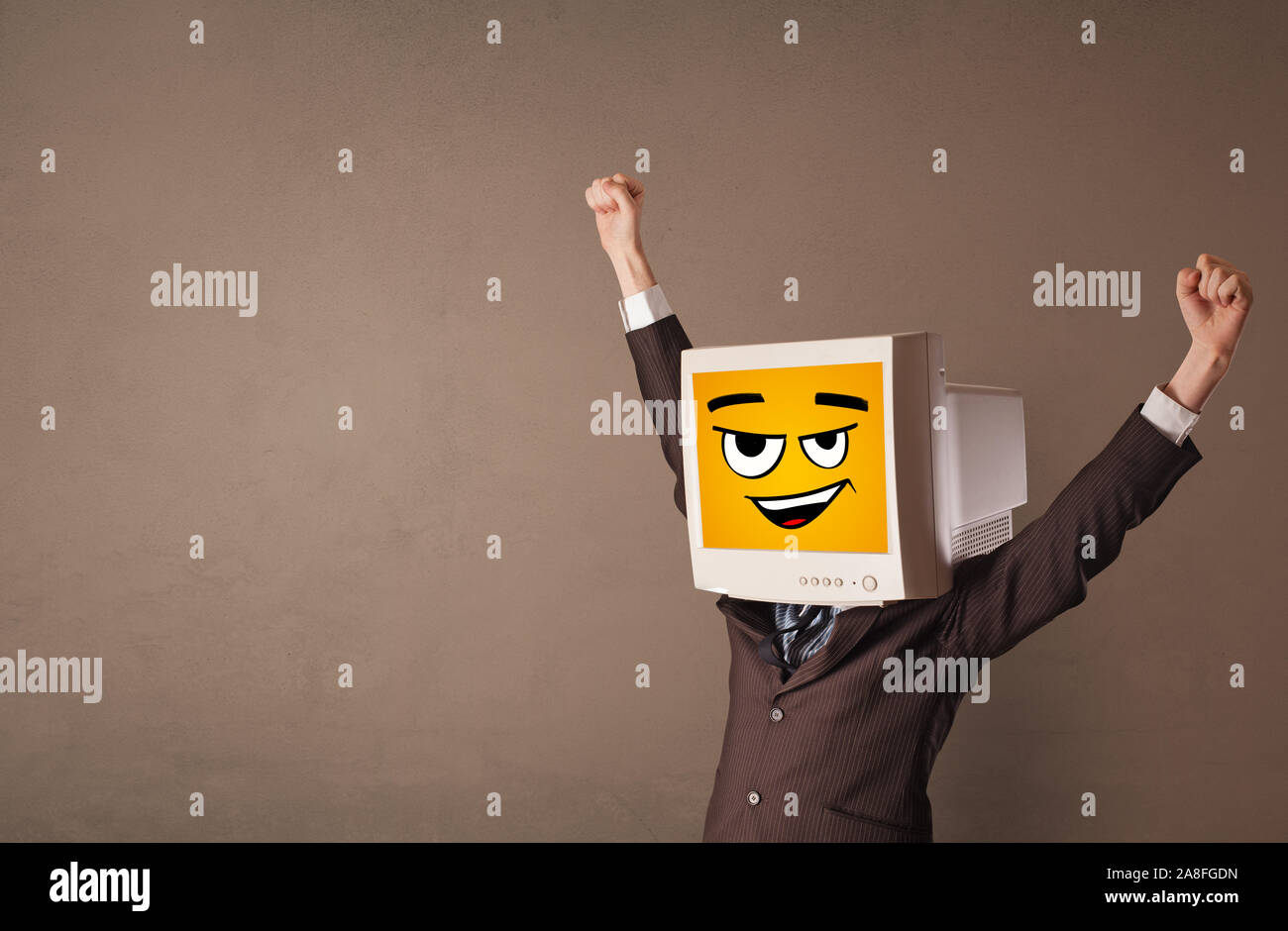 Young person with happy smiley monitor head Stock Photo - Alamy