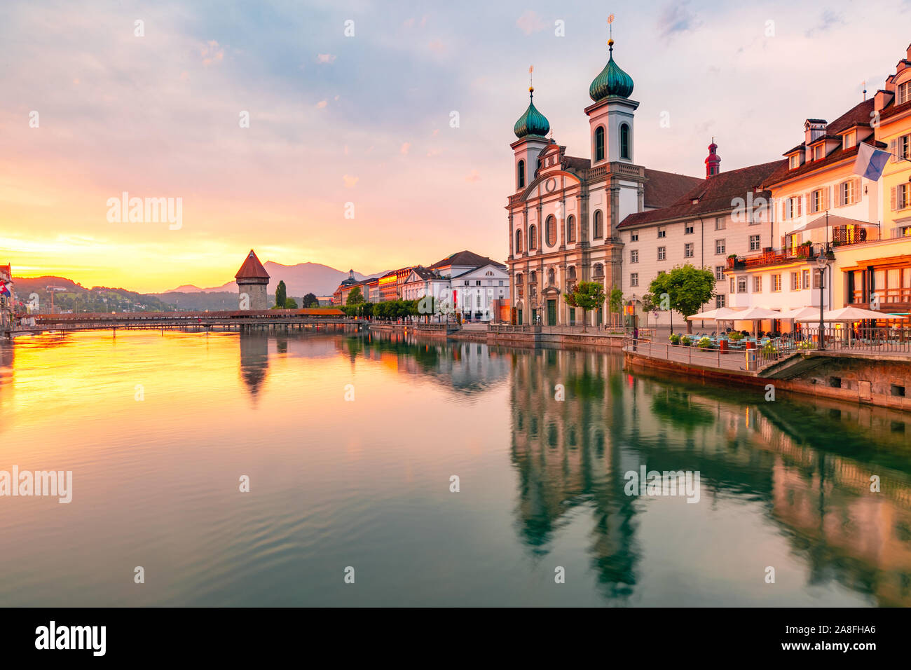 Jesuit Church, Water Tower, Wasserturm and the river Reuss at sunrise ...
