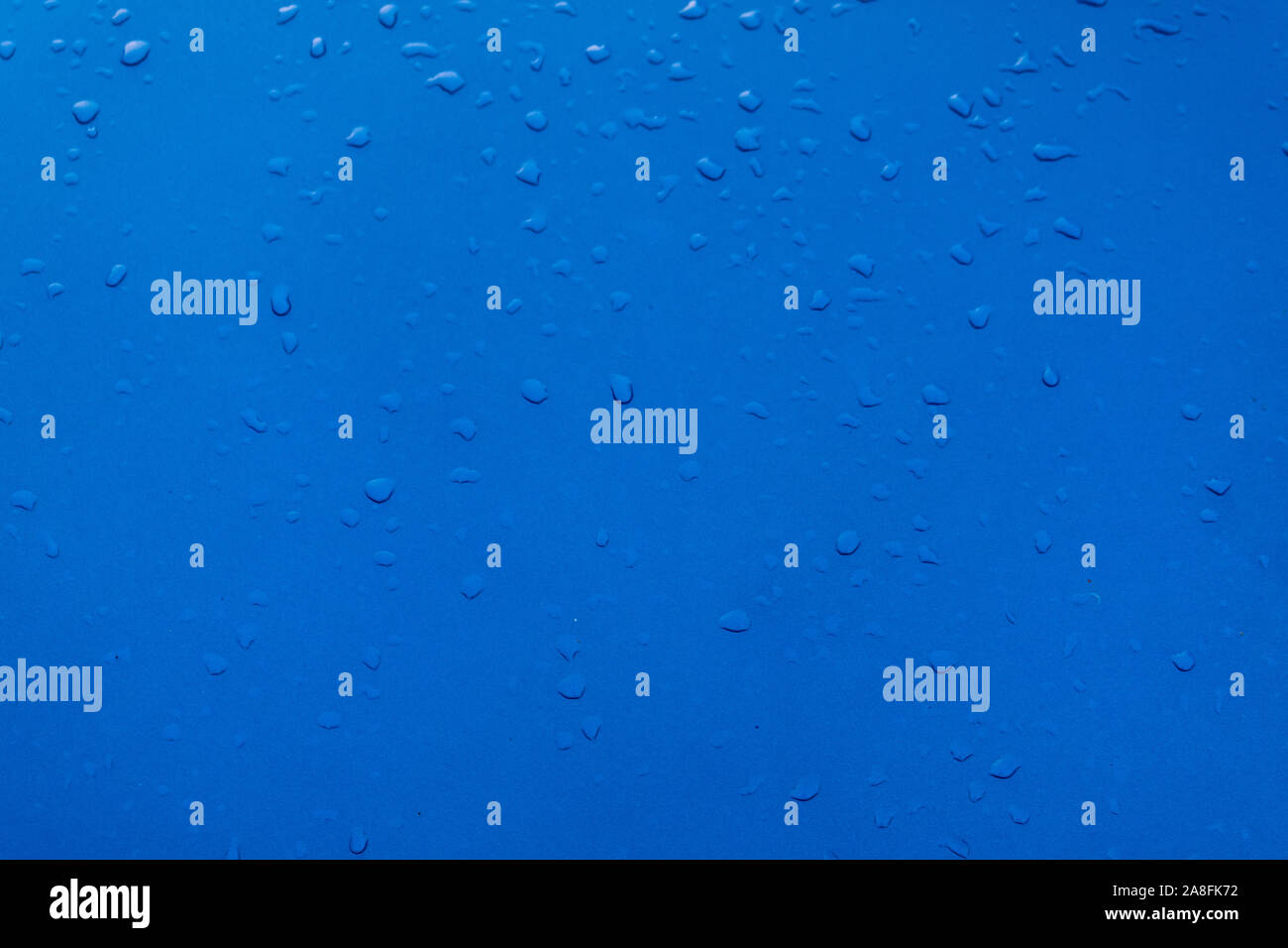 water drops on blue surface. Pantone Classic Blue Stock Photo - Alamy