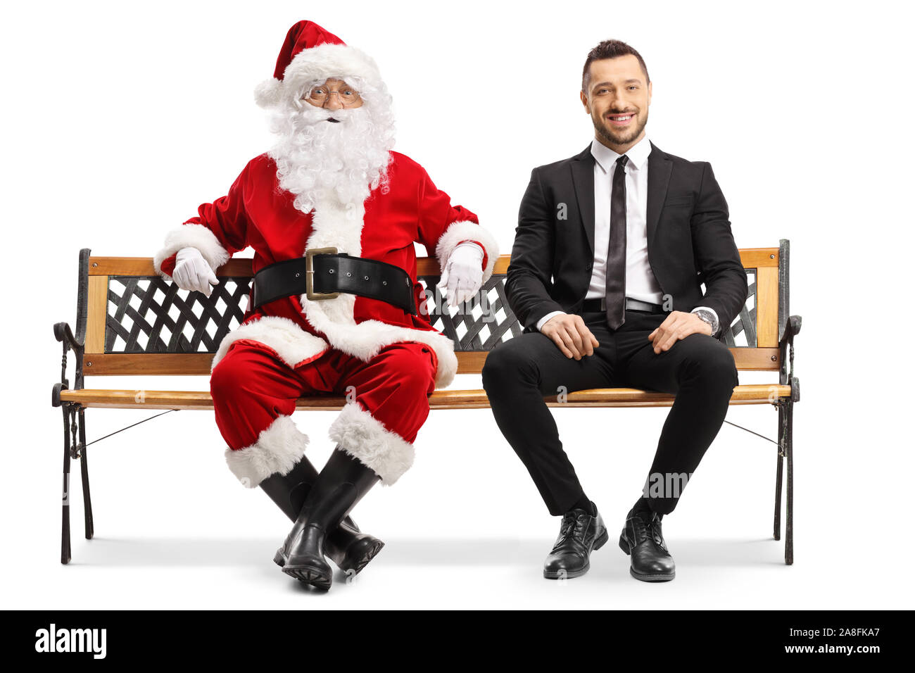 Full length portrait of happy Santa Claus sitting on a bench with a ...