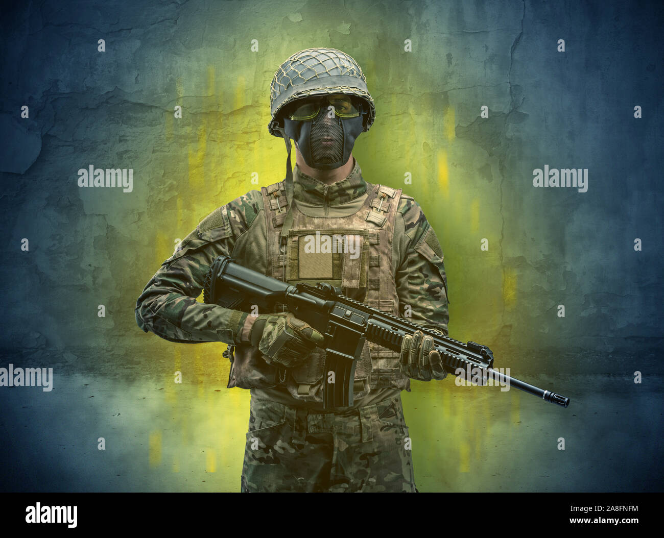 Hazard, menace soldier in a ruined crumbly building with arms on his ...