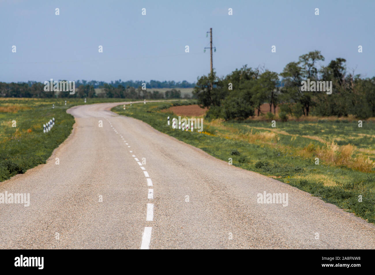 Smooth asphalt road to the mountains road to the distance beyond the ...