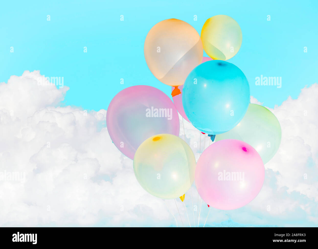 Colorful baloons over white clouds Stock Photo - Alamy