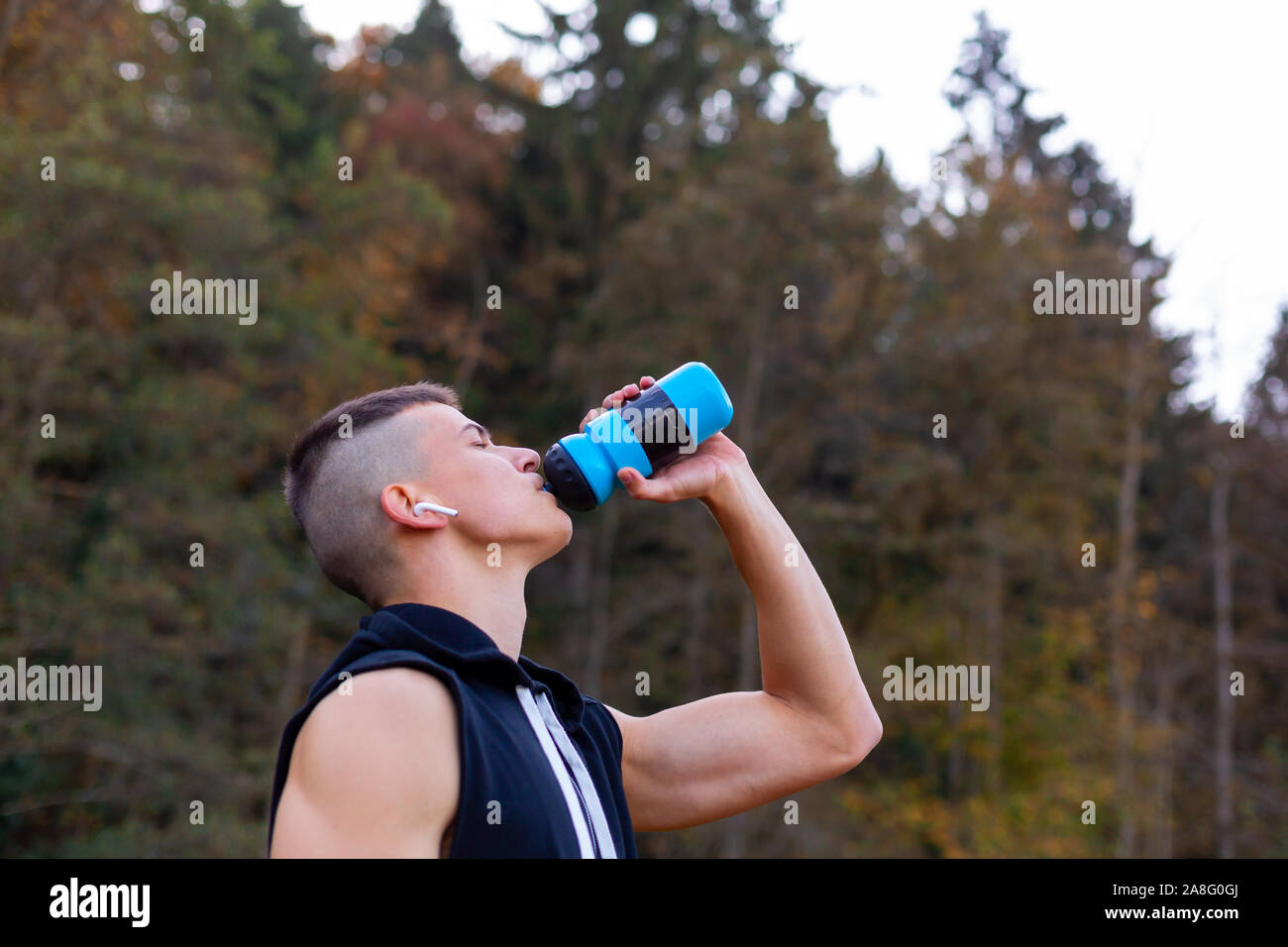 Young man drinking water from bottle hi-res stock photography and ...