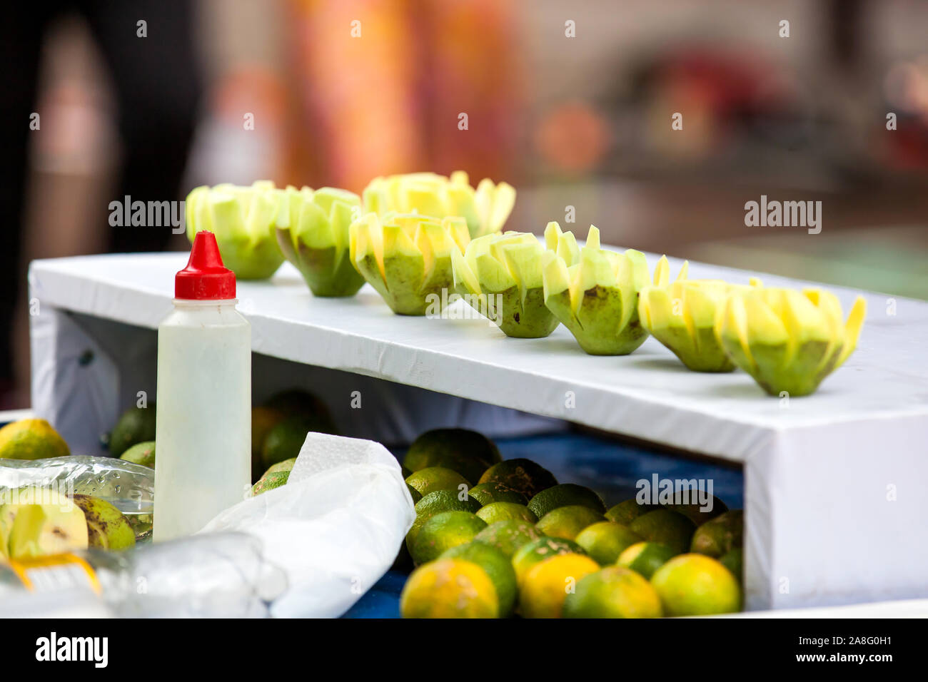 Street vendor of green mango in the city of Cali in Colombia Stock ...