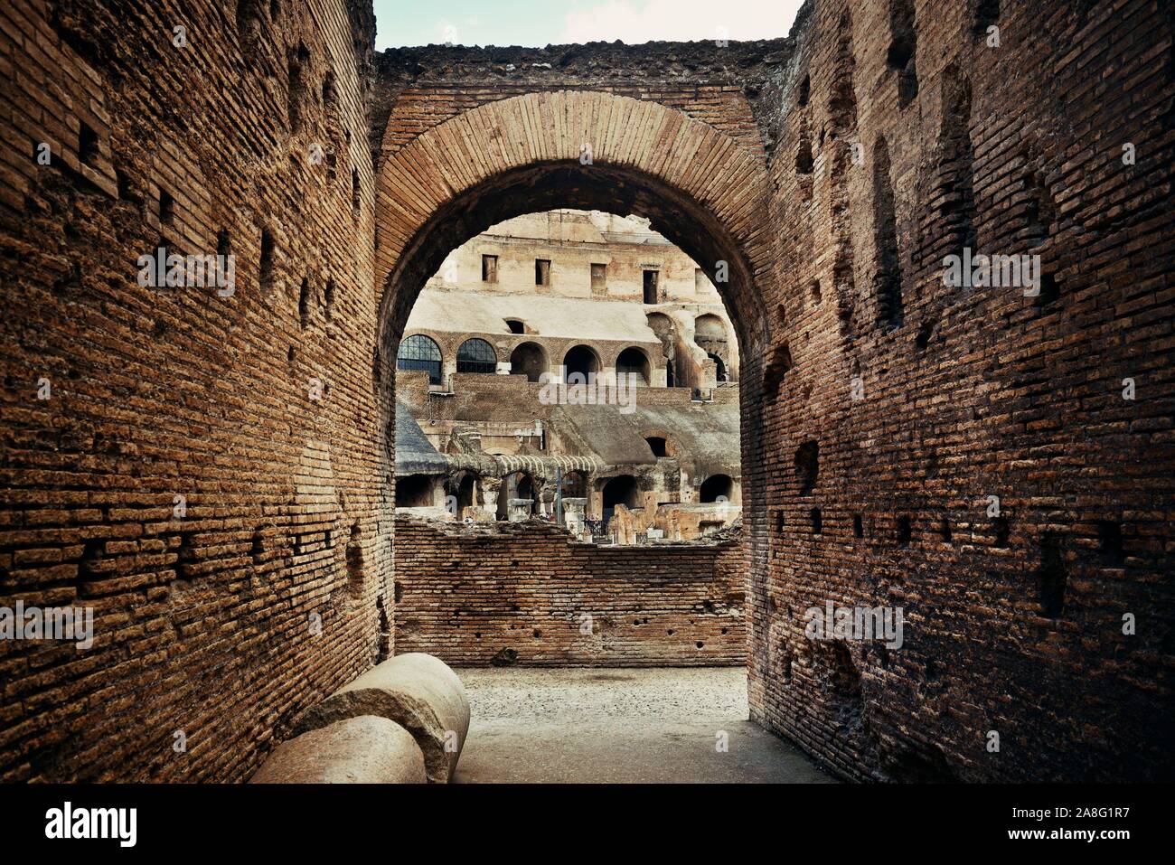 Archway in Colosseum, the world known landmark and the symbol of Rome ...
