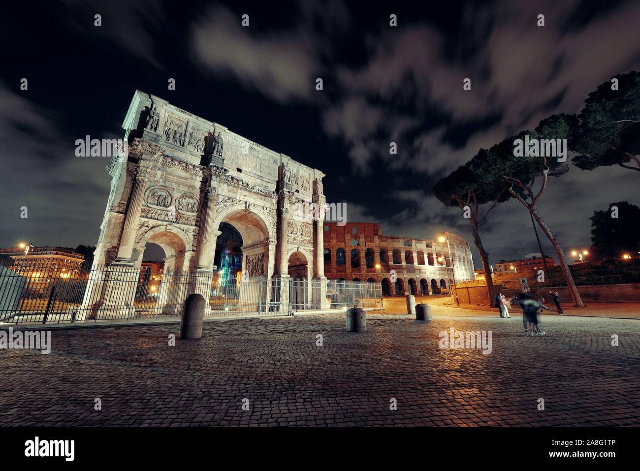 Arch of Constantine and Colosseum at night in Rome, Italy Stock Photo ...