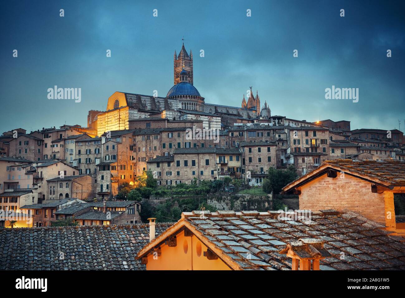 Medieval town skyline view with Siena Cathedral and historic buildings ...
