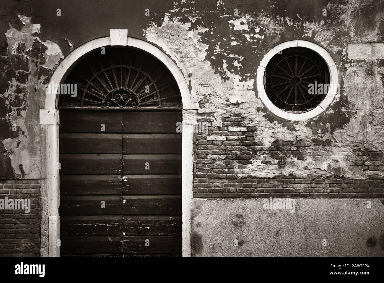Vintage door and window in old buildings in Venice, Italy Stock Photo ...