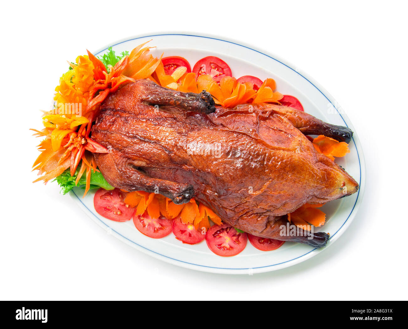 Roasted duck fusion food Chinese style decorate with carved vegetables ...
