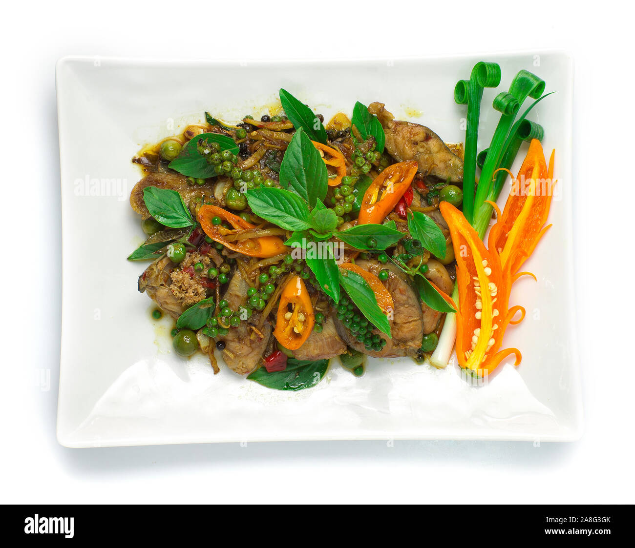 Thai spicy stir fried catfish with Thai herbs decorate yellow chili ...