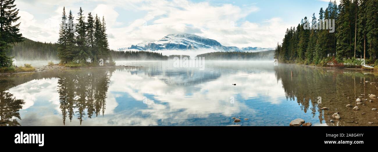 Two Jack lake with snow mountain and water reflection panorama in Banff ...