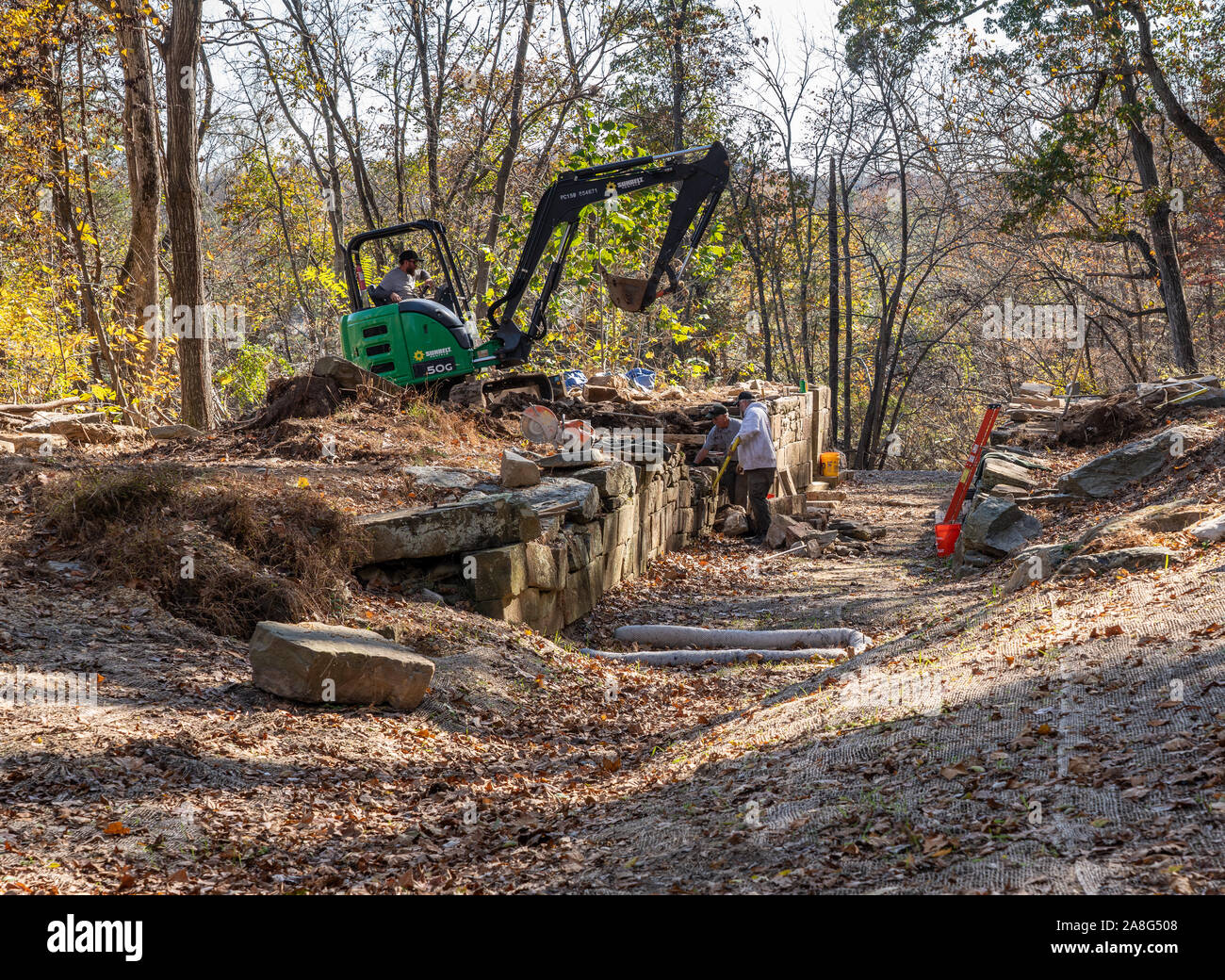 Great Falls, VA - 6 November 2019: Workmen repair the old stone canal ...
