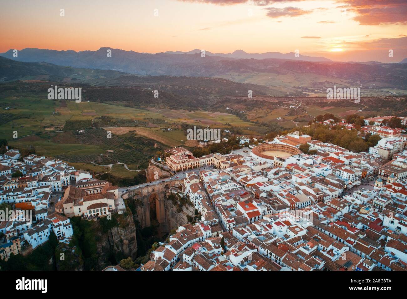 Ronda aerial view at sunrise with old buildings in Spain Stock Photo ...