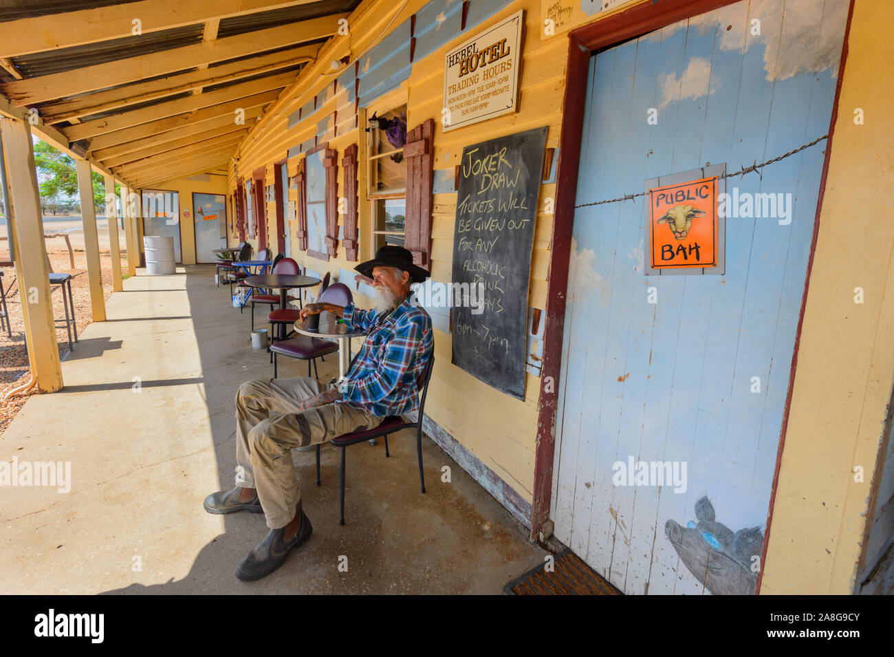 An old timer sitting in the verandah of the iconic Hebel Hotel, Balonne ...