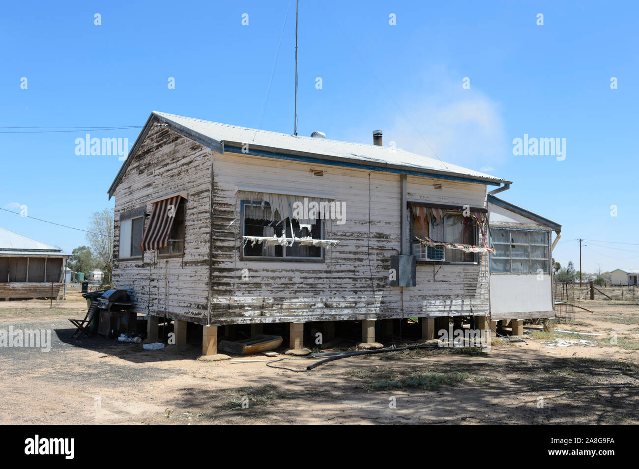 A white derelict wooden shack in Carinda, near Walgett, New South Wales ...