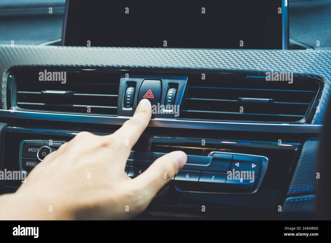 Presses the emergency stop in the car by hand of man Stock Photo - Alamy