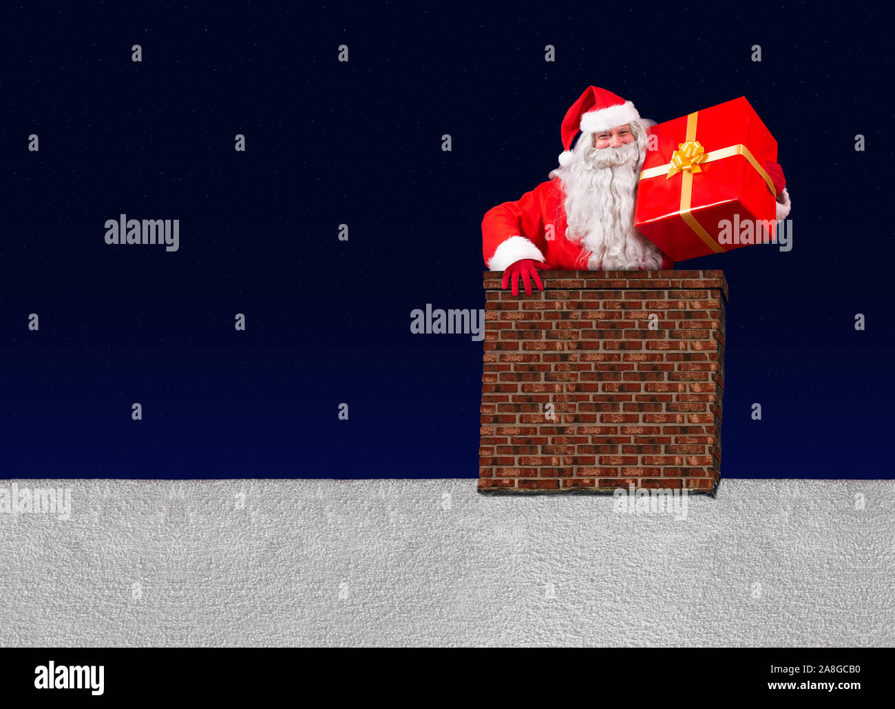 Cheerful Santa Claus peek out from a chimney on snowy roof and hold ...