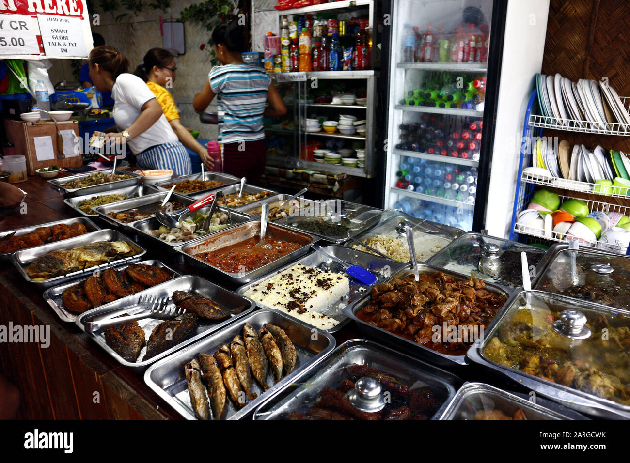 TAYTAY, RIZAL, PHILIPPINES – NOVEMBER 7, 2019: Woman serves assorted ...
