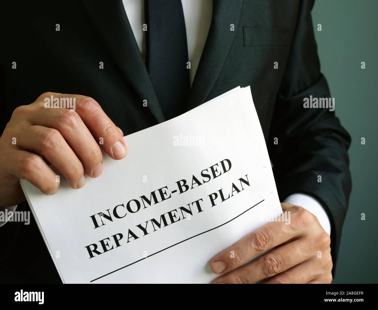 Income-based repayment plan ibr in the hands Stock Photo - Alamy